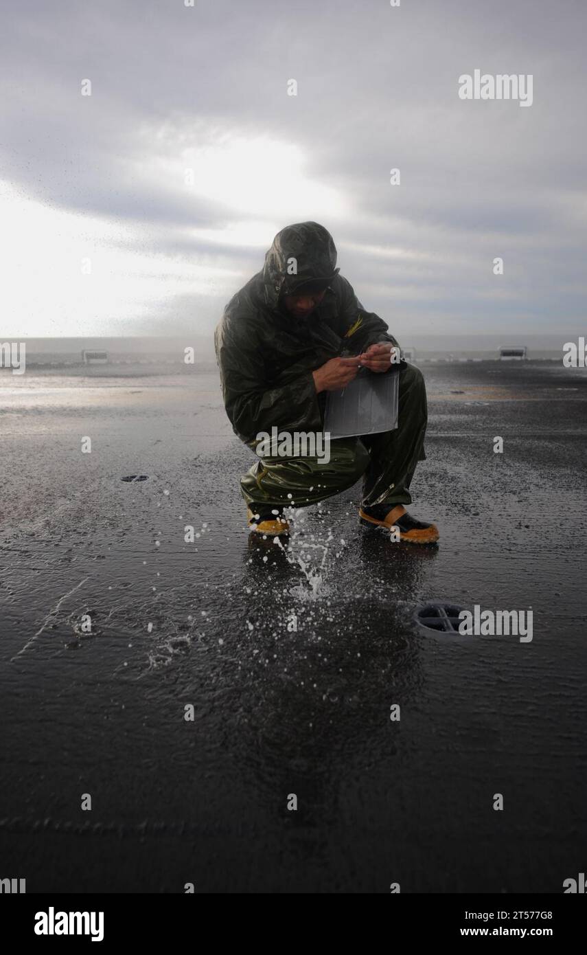 US Navy Sailors aboard the amphibious assault ship USS Bonhomme Richard ...