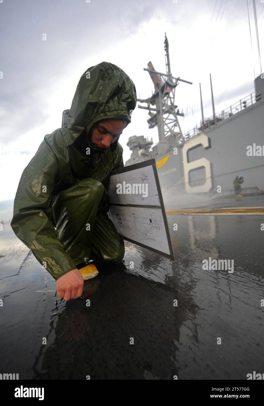 US Navy Sailors aboard the amphibious assault ship USS Bonhomme Richard ...