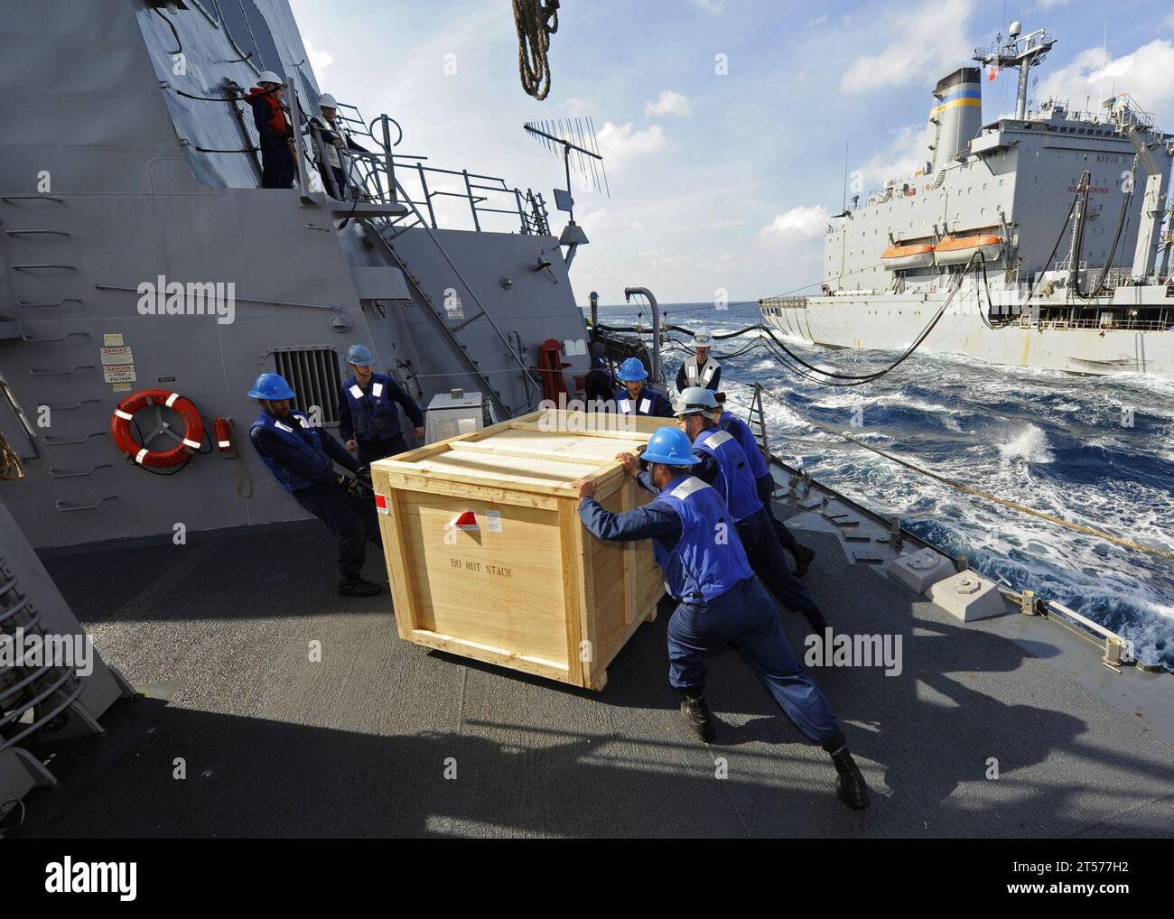US Navy Sailors aboard the Arleigh Burke-class guided-missile destroyer ...