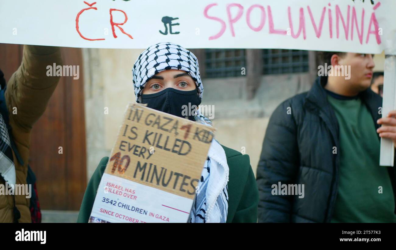 Palestine demonstration woman banner in Gaza 1 kid is killed every 10 ...