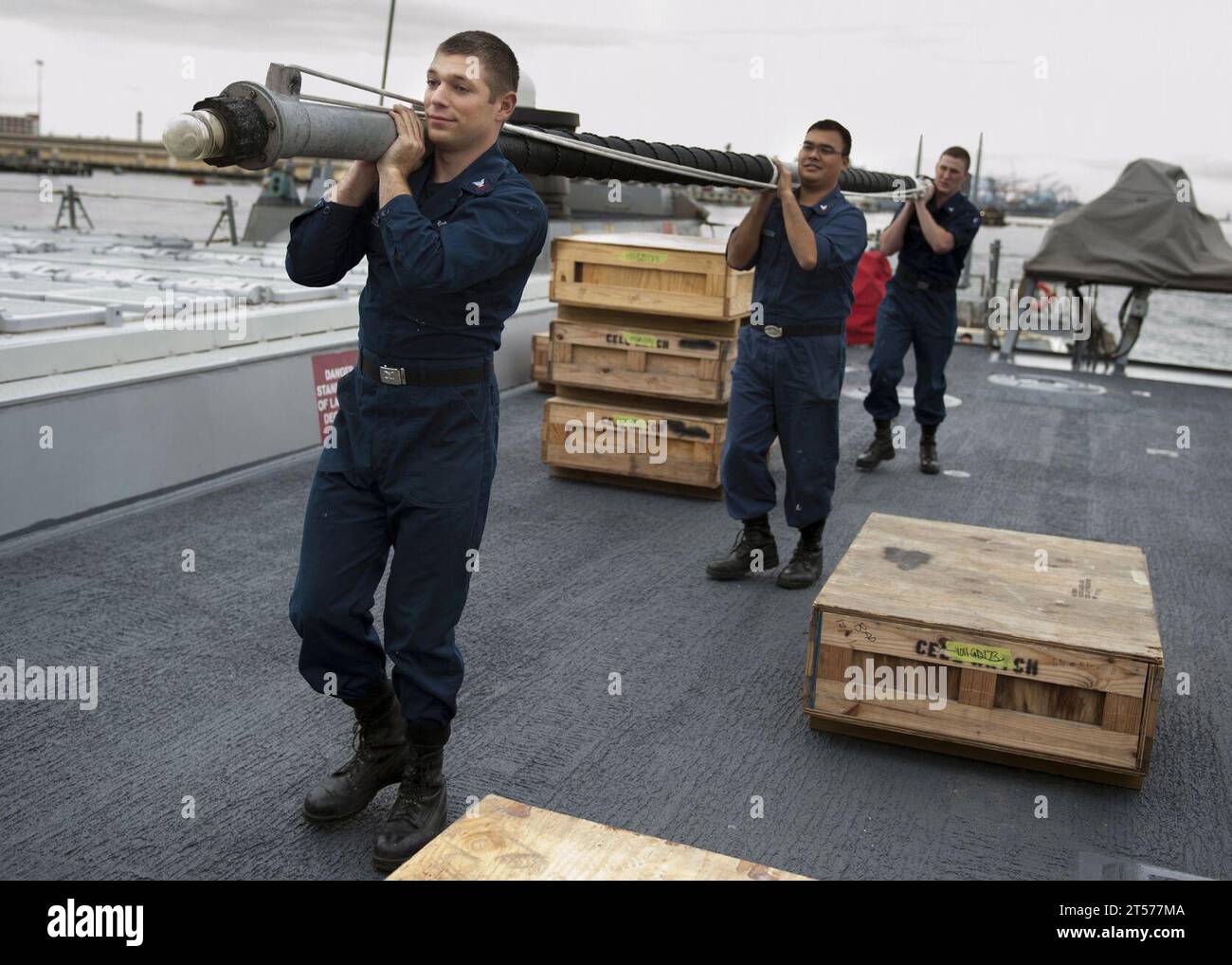 US Navy Sailors aboard the Arleigh Burke-class guided-missile destroyer ...