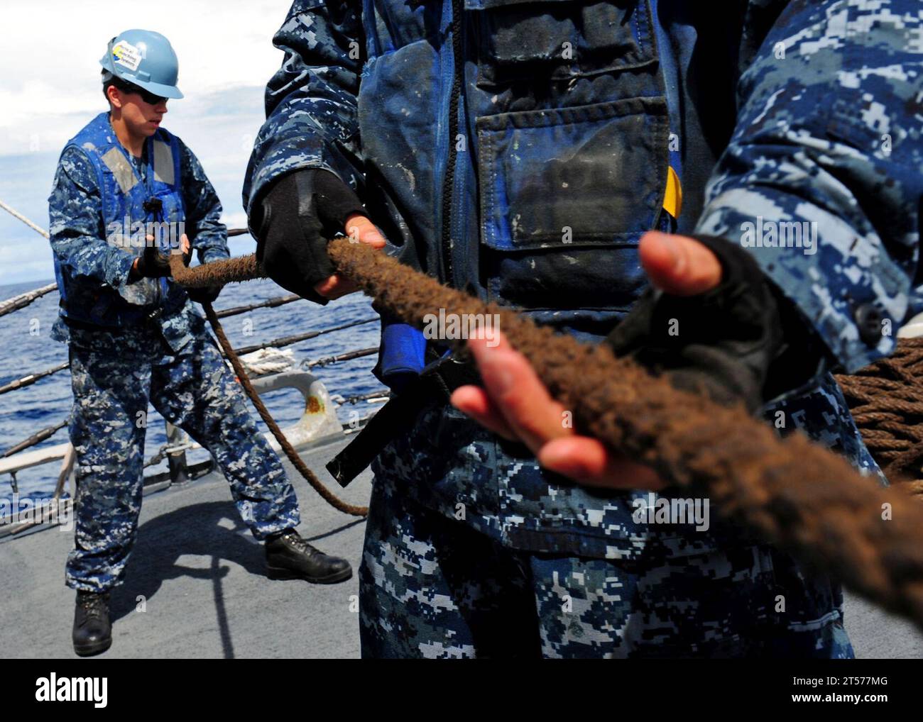 US Navy Sailors aboard the Arleigh Burke-class guided-missile destroyer ...
