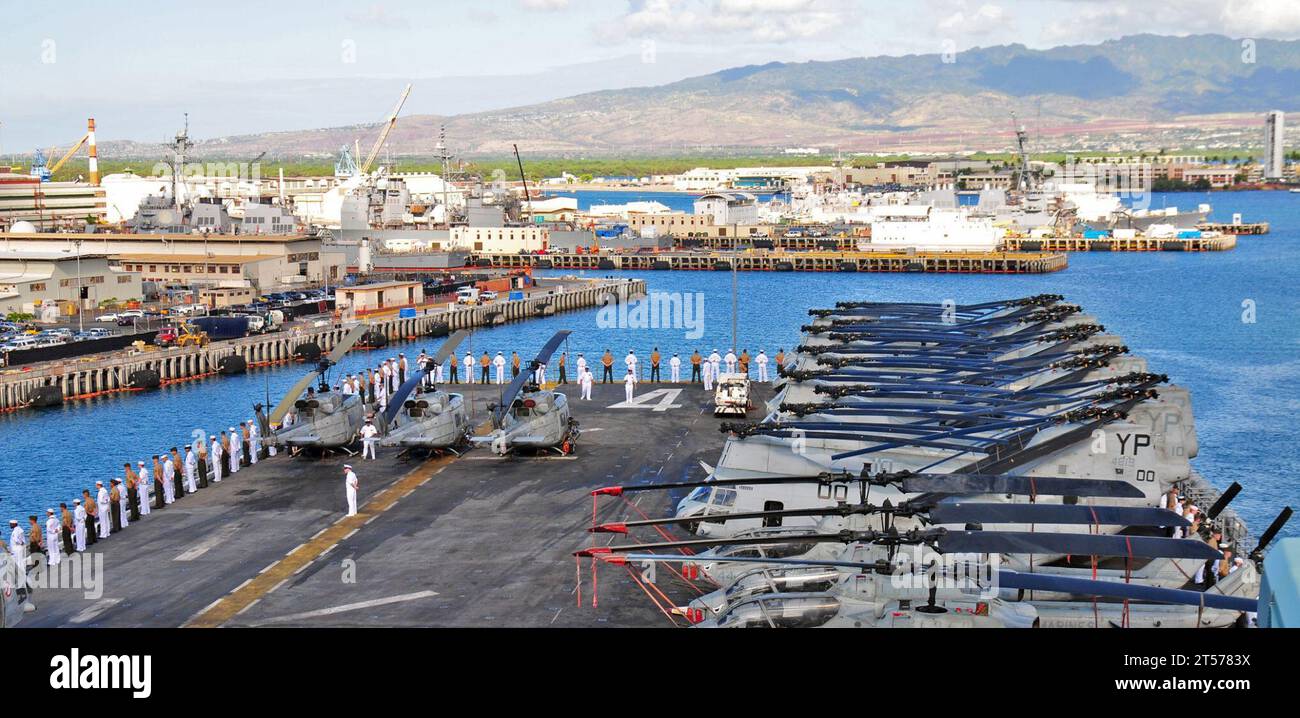 US Navy Sailors and Marines man the rails aboard the amphibious assault ...