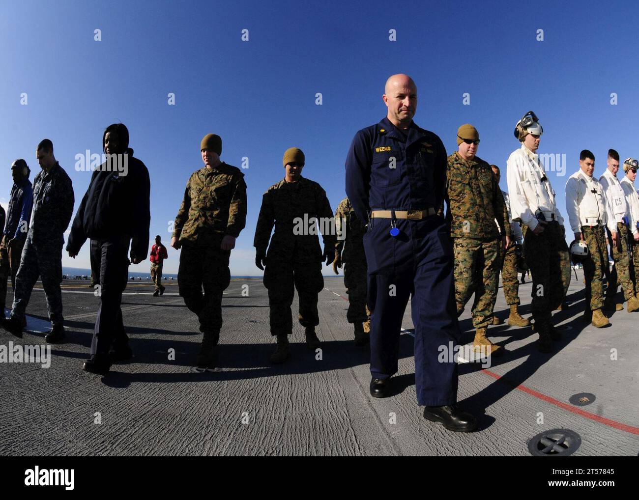 US Navy Sailors and Marines conduct a foreign object debris walk down ...