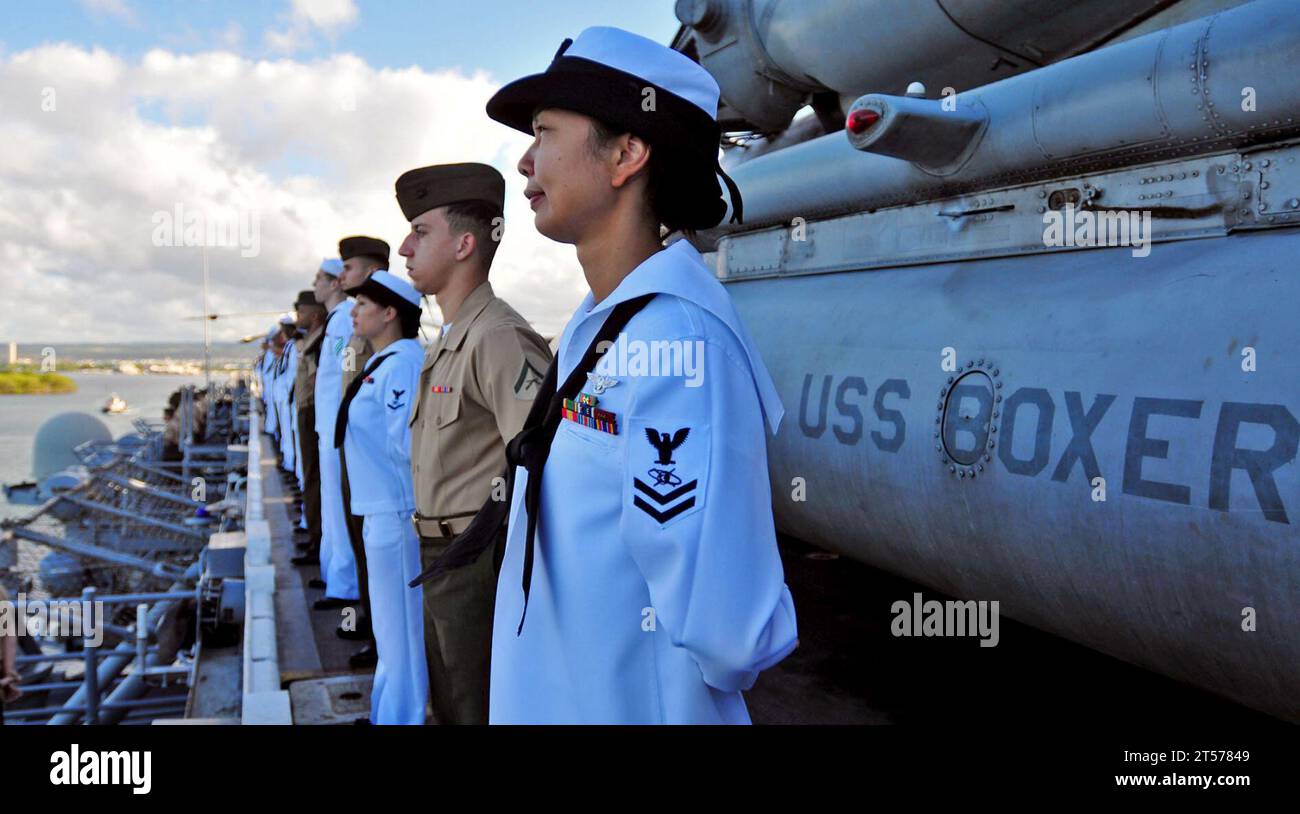 US Navy Sailors and Marines man the rails aboard the amphibious assault ...