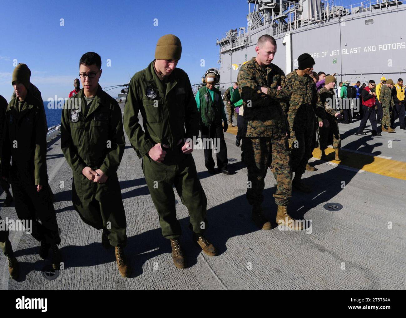 US Navy Sailors and Marines conduct a foreign object debris walk down ...