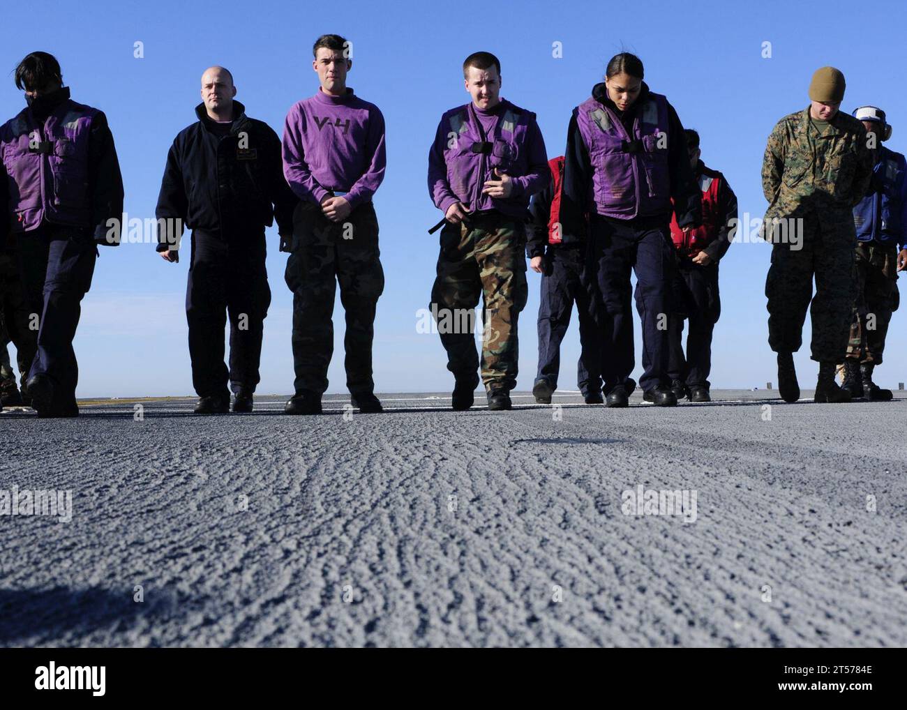 US Navy Sailors and Marines conduct a foreign object debris walk down ...