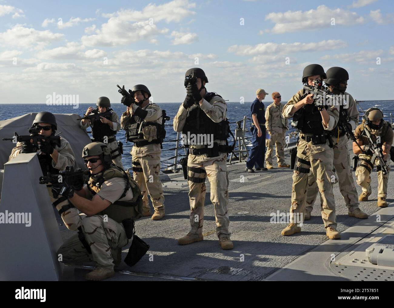 US Navy Sailors and Coast Guardsmen aboard the Arleigh Burke-class ...