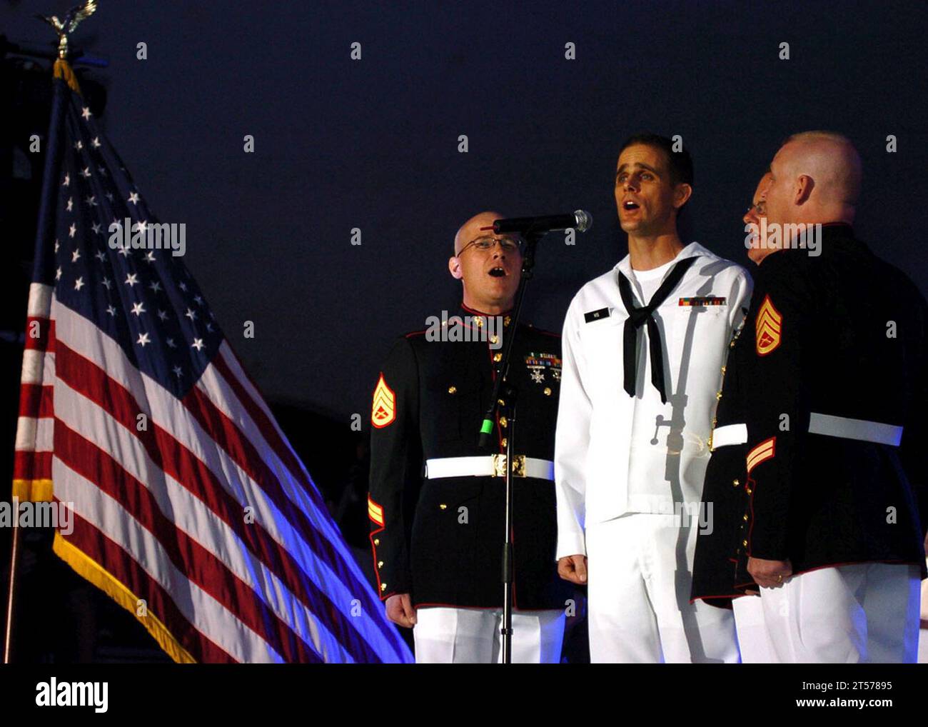 US Navy Sailors and Marines perform the national anthem to a capacity ...