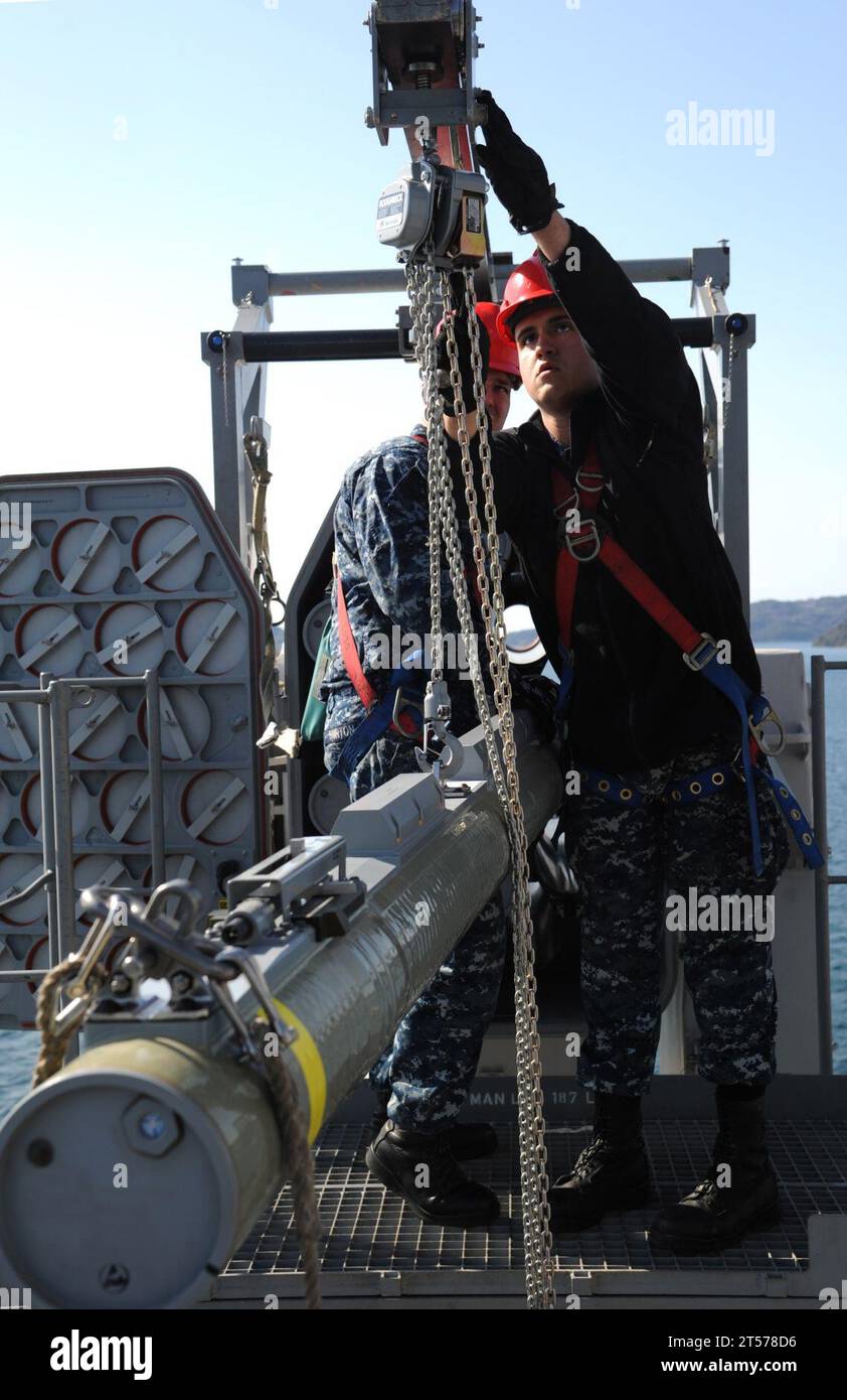 US Navy Sailors assigned to the amphibious dock landing ship USS ...