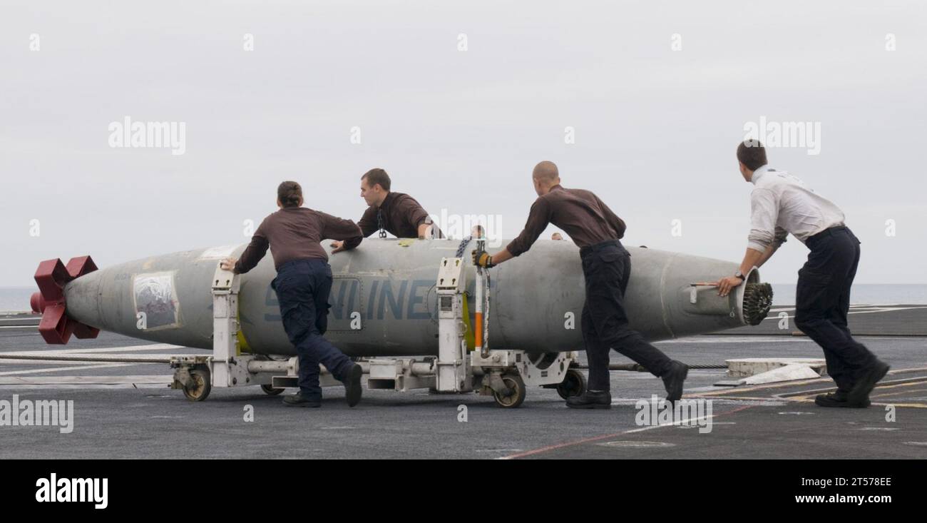 US Navy Sailors assigned to Strike Fighter Squadron (VFA) 22 transport ...