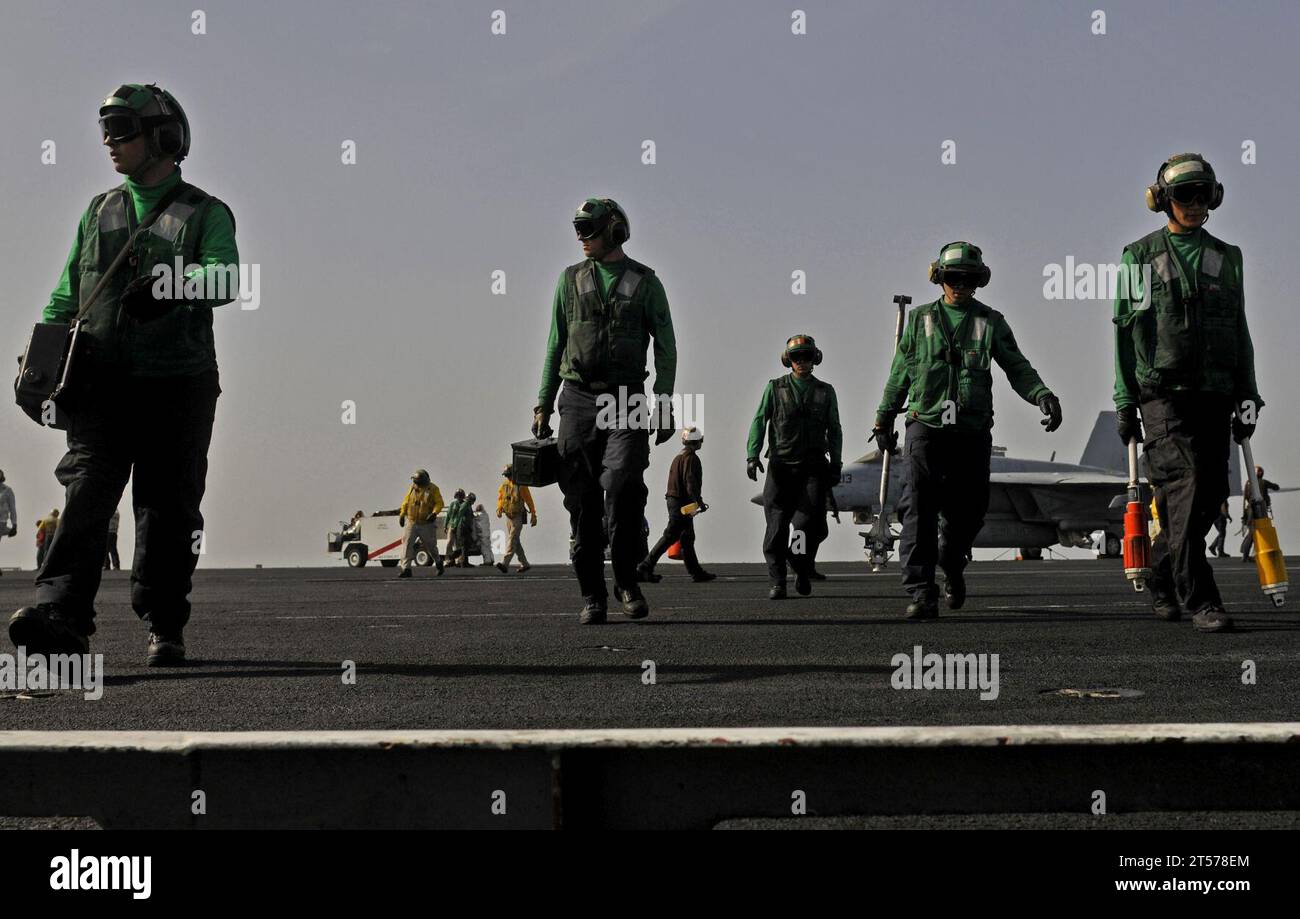 US Navy Sailors assigned to the Air Department aboard the Nimitz-class ...