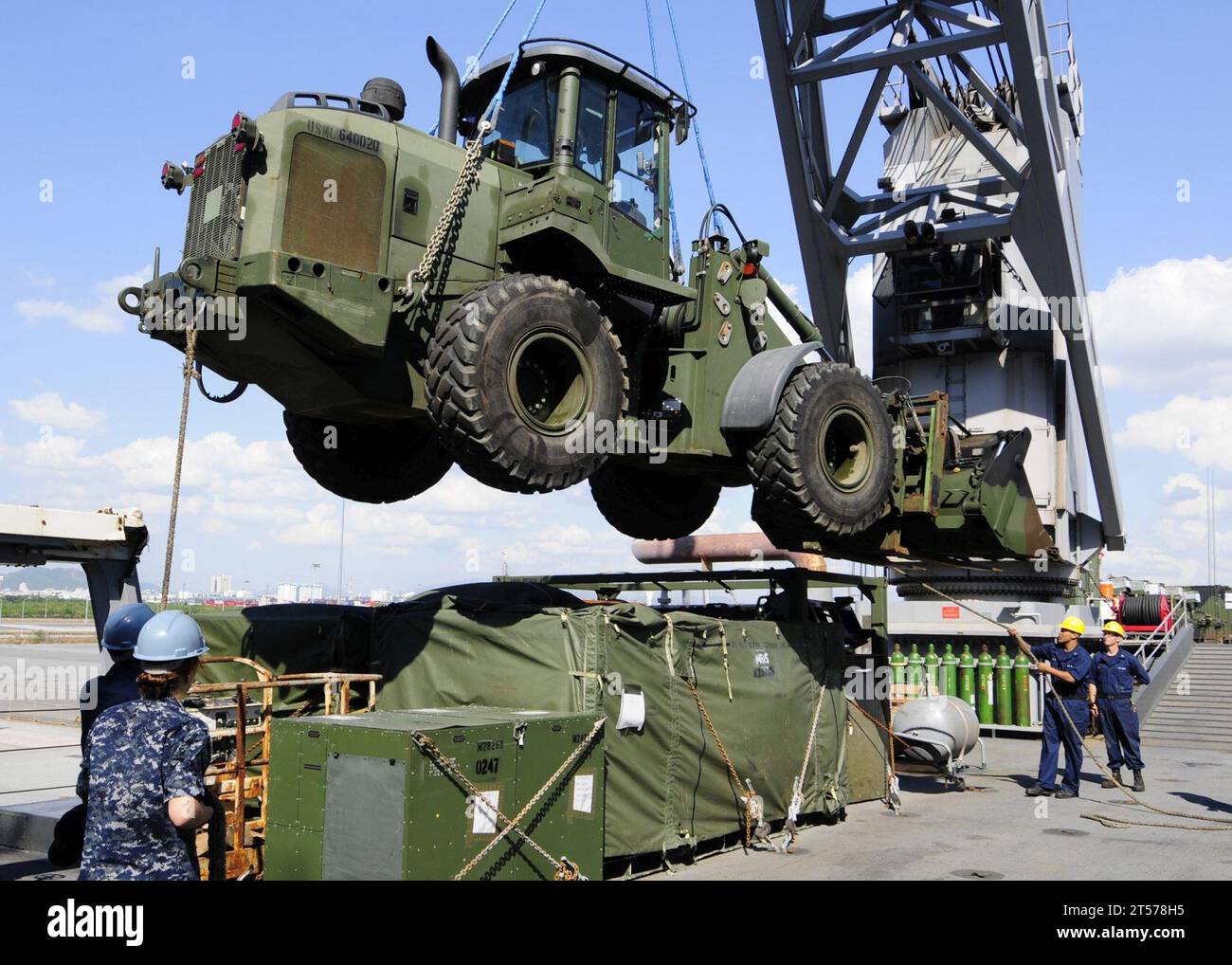 US Navy Sailors assigned to the forward-deployed amphibious dock ...
