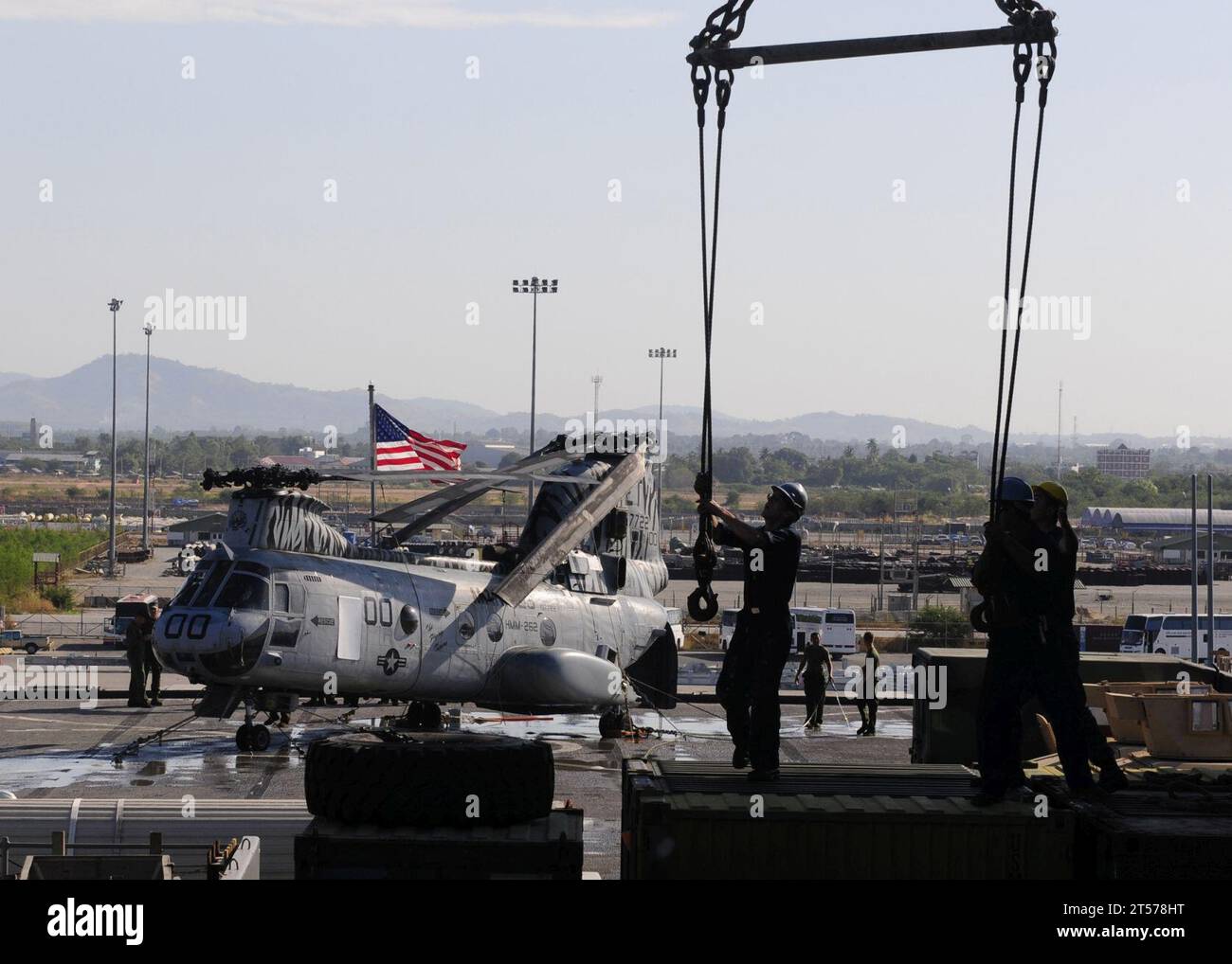 US Navy Sailors assigned to the forward-deployed amphibious dock ...