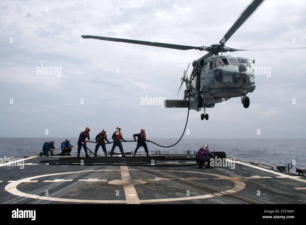 US Navy Sailors assigned to the guided-missile frigate USS McClusky ...