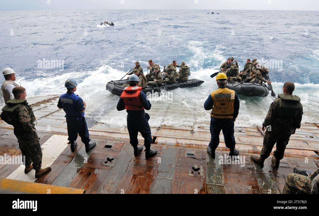 US Navy Sailors assigned to the forward-deployed amphibious dock ...