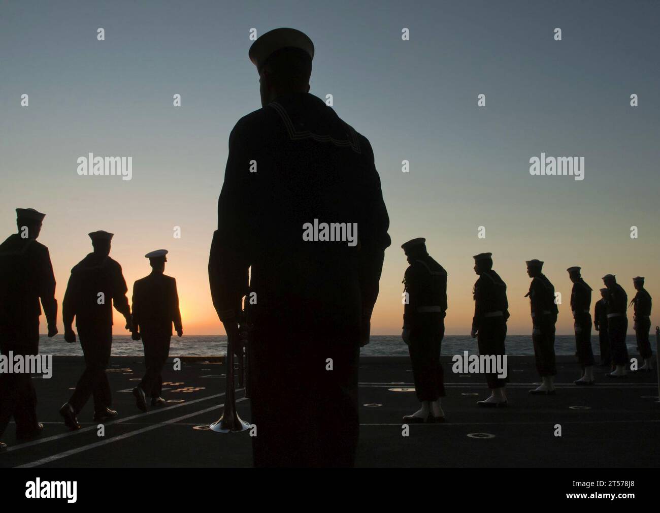 US Navy Sailors assigned to the burial detail arrive on an aircraft ...