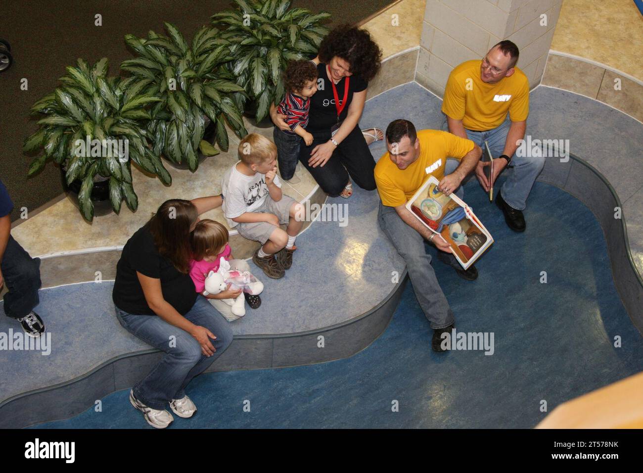 US Navy Sailors assigned to the Navy Operational Support Center read to ...