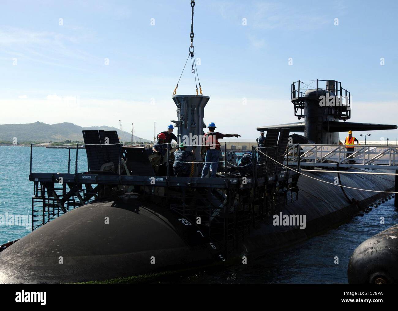 US Navy Sailors assigned to the submarine tender USS Frank Cable (AS 40 ...