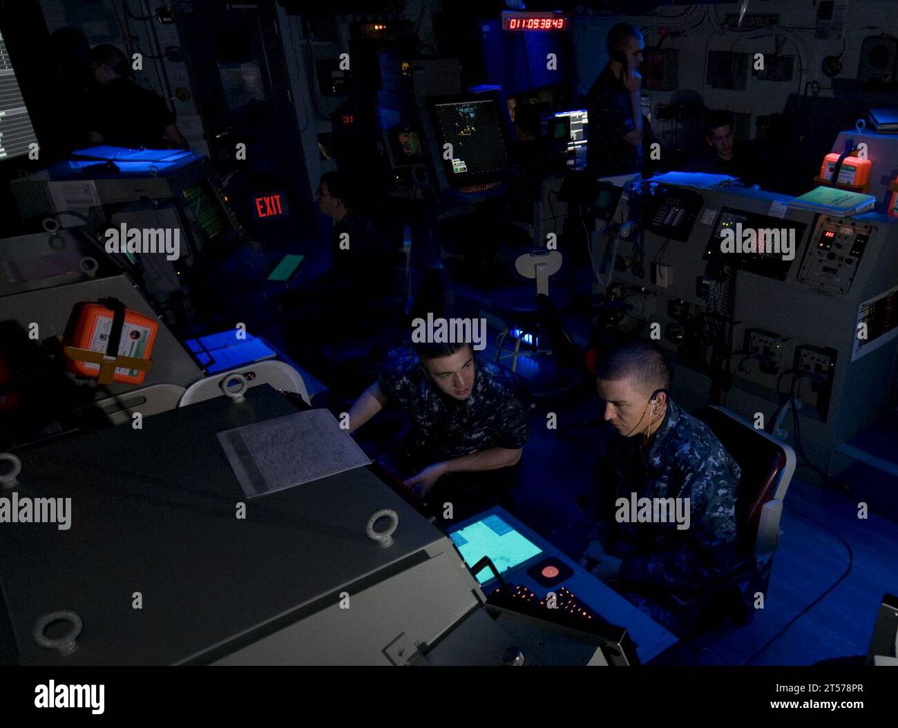 US Navy Sailors assigned to the operations department aboard the Nimitz ...