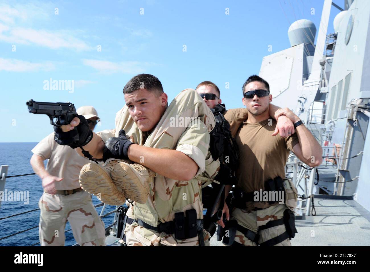 US Navy Sailors assigned to the visit, board, search, and seizure team ...