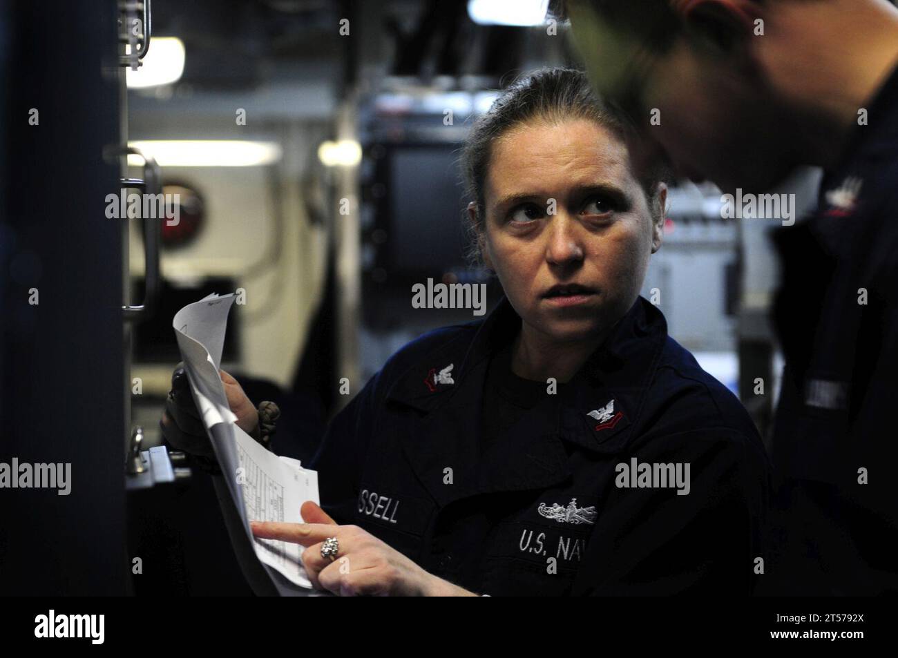 US Navy Sailors configure the global broadcast system in the main ...