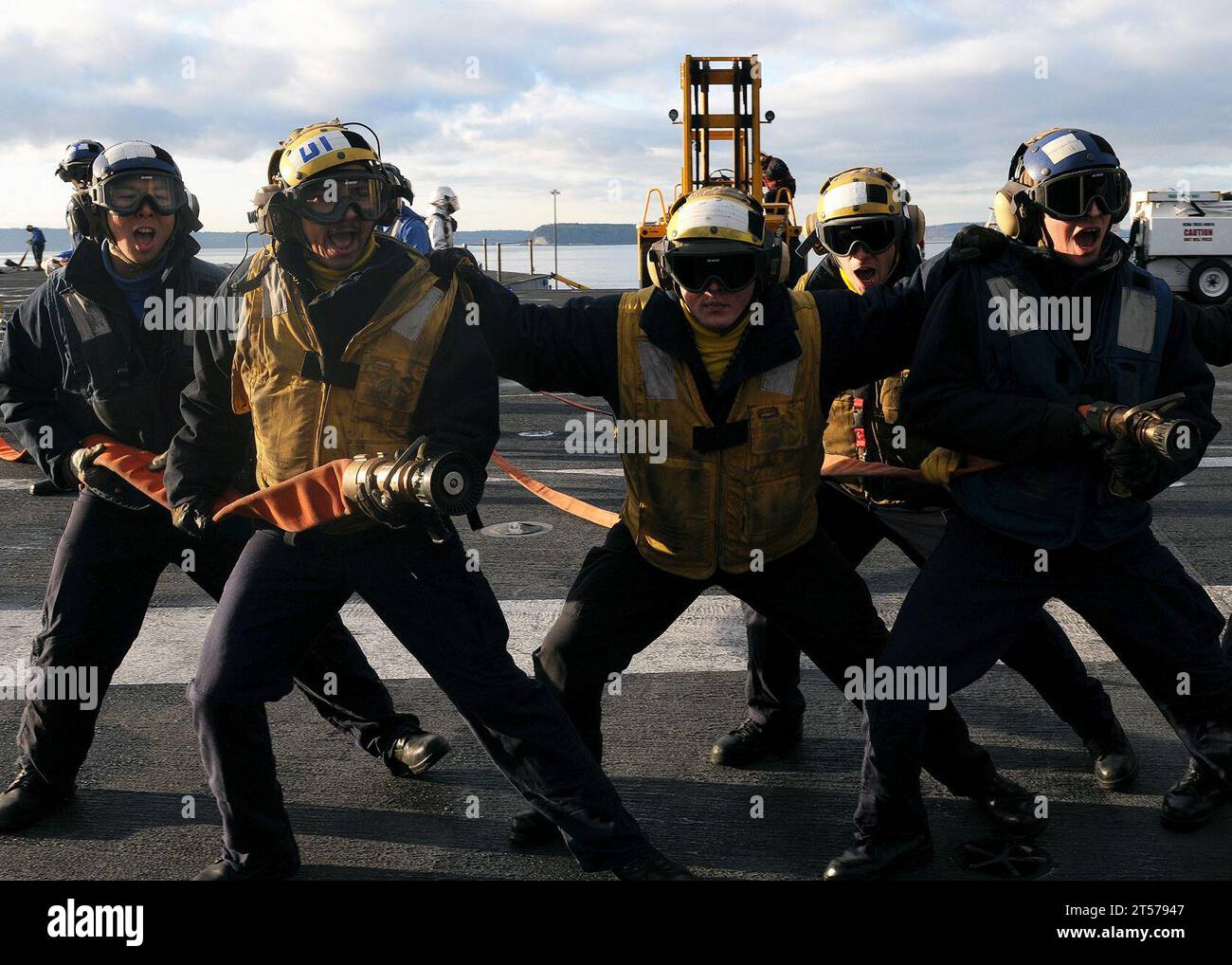 US Navy Sailors conduct firefighting training aboard the Nimitz-class ...