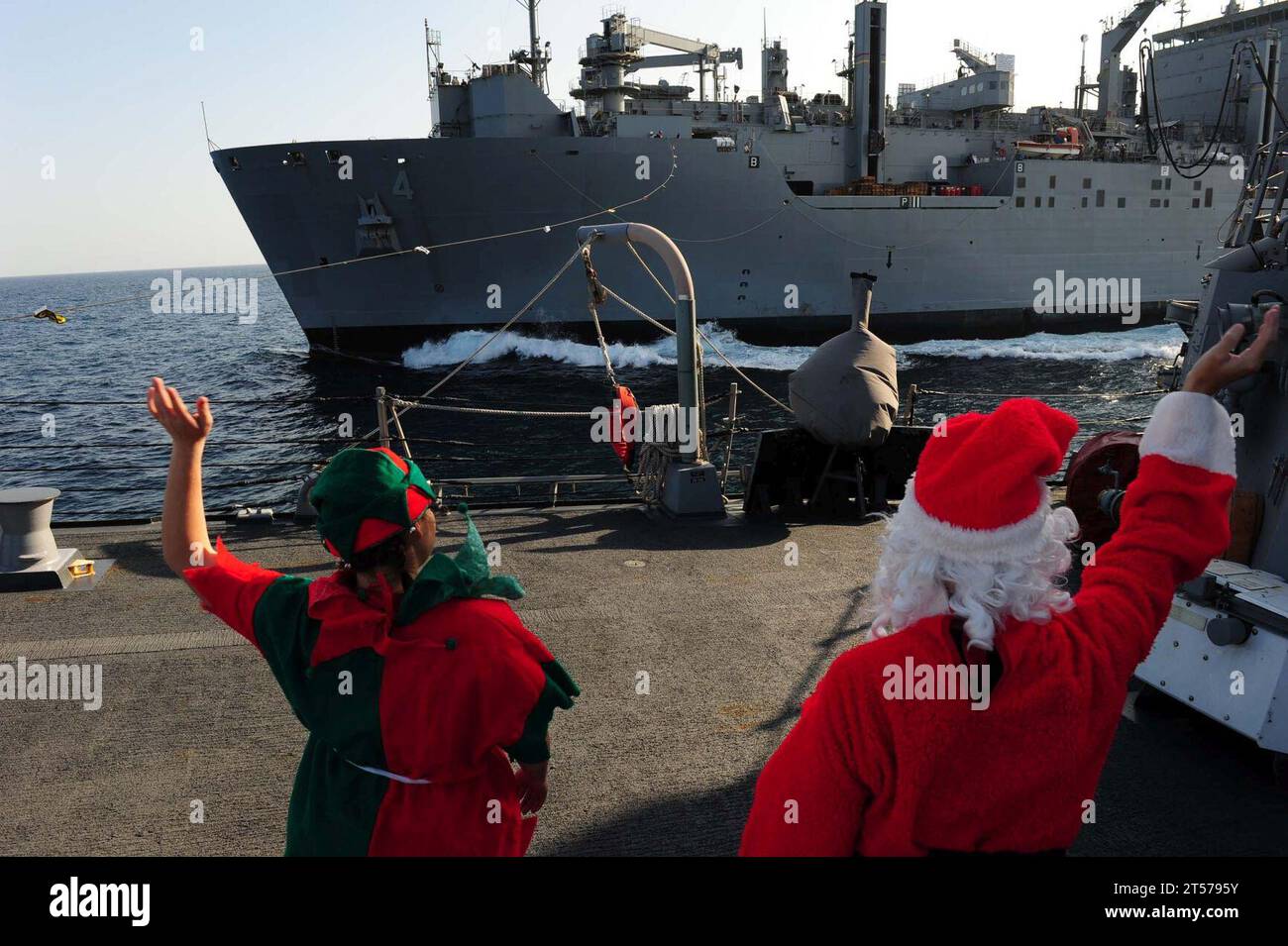 US Navy Sailors dressed as an elf and Santa Clause, assigned to the ...
