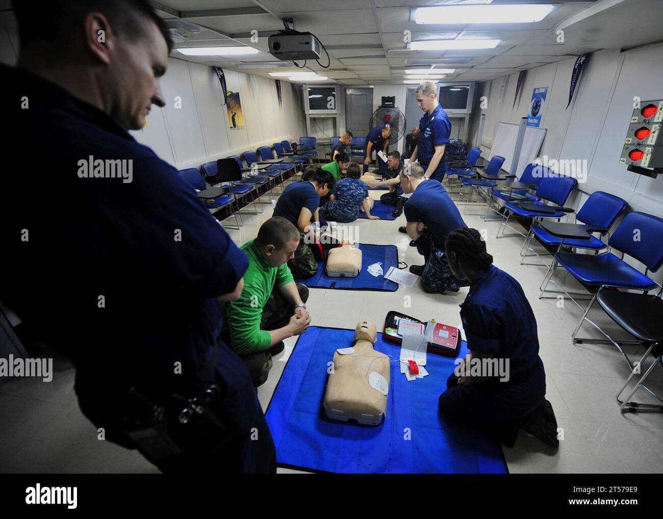 US Navy Sailors learn first aid at a CPR class aboard the Nimitz-class ...