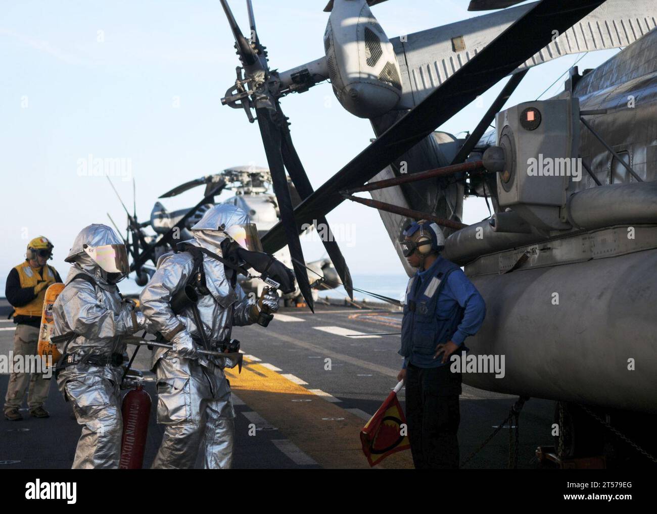 US Navy Sailors investigate a simulated fire during a fire drill.jpg ...