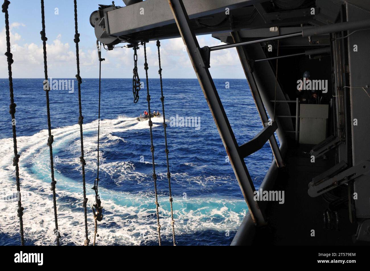 US Navy Sailors launch a rigid-hull inflatable boat during a man ...