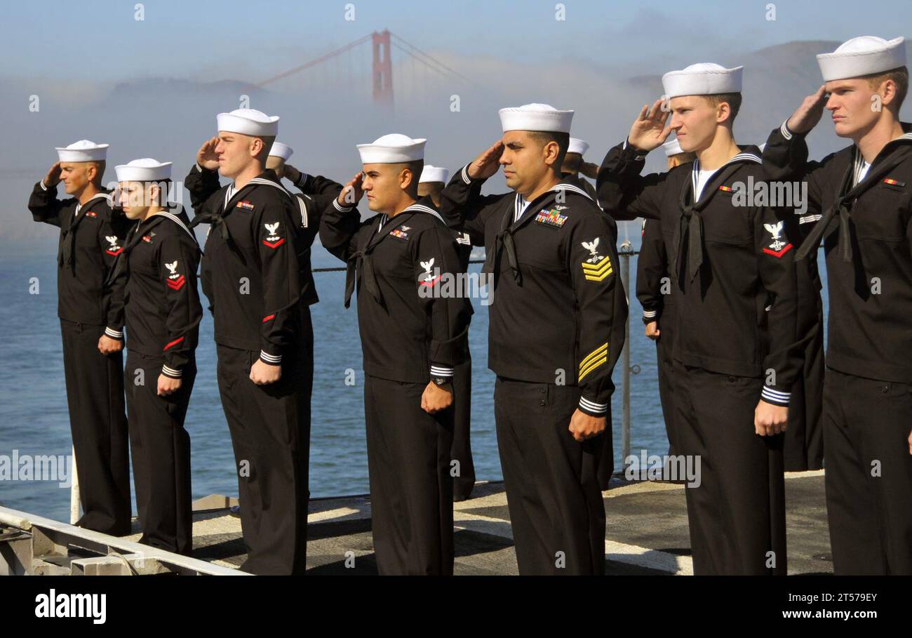 US Navy Sailors man the rails aboard the Nimitz-class aircraft carrier ...