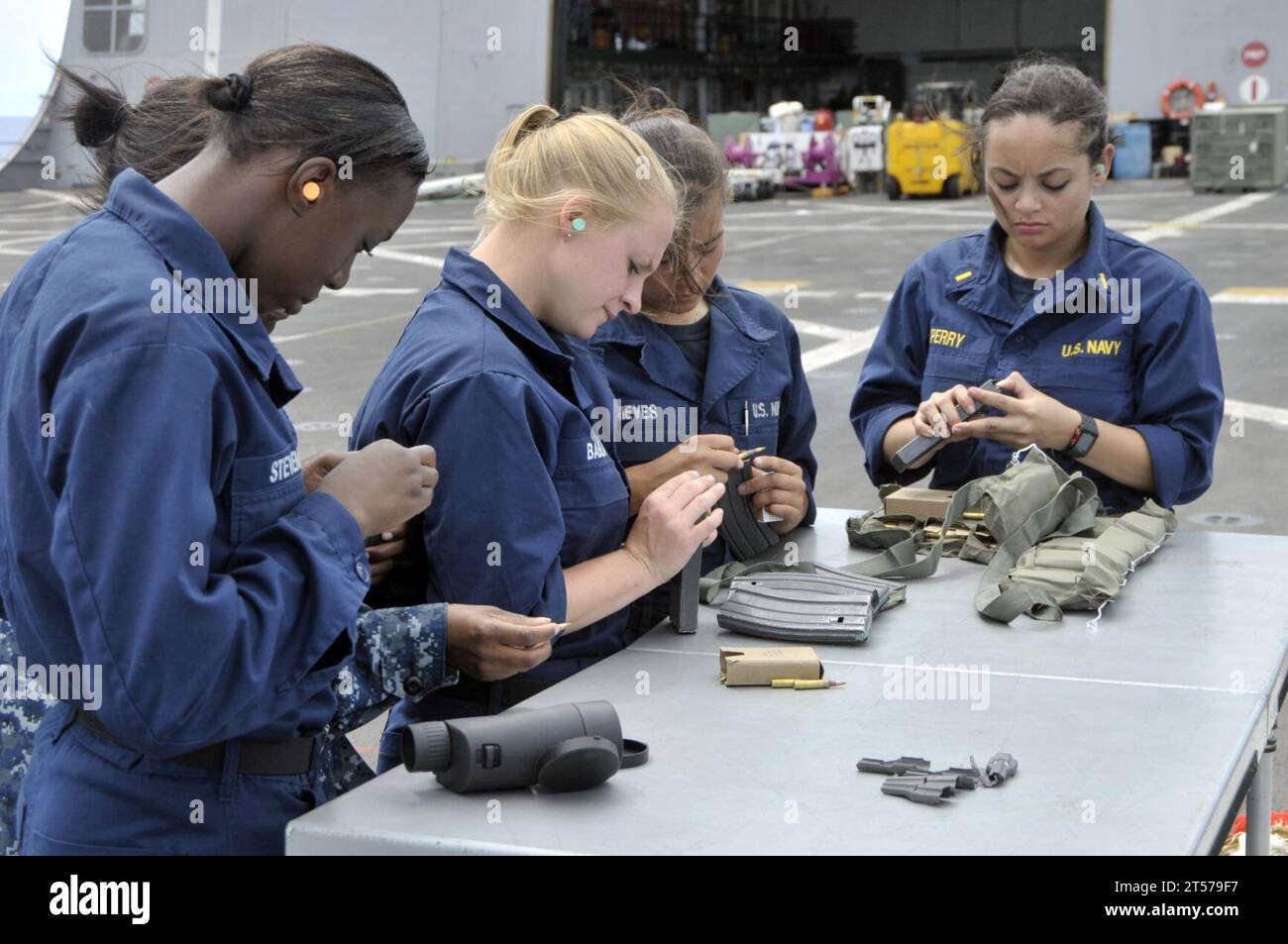 US Navy Sailors load ammunition into magazines.jpg Stock Photo - Alamy