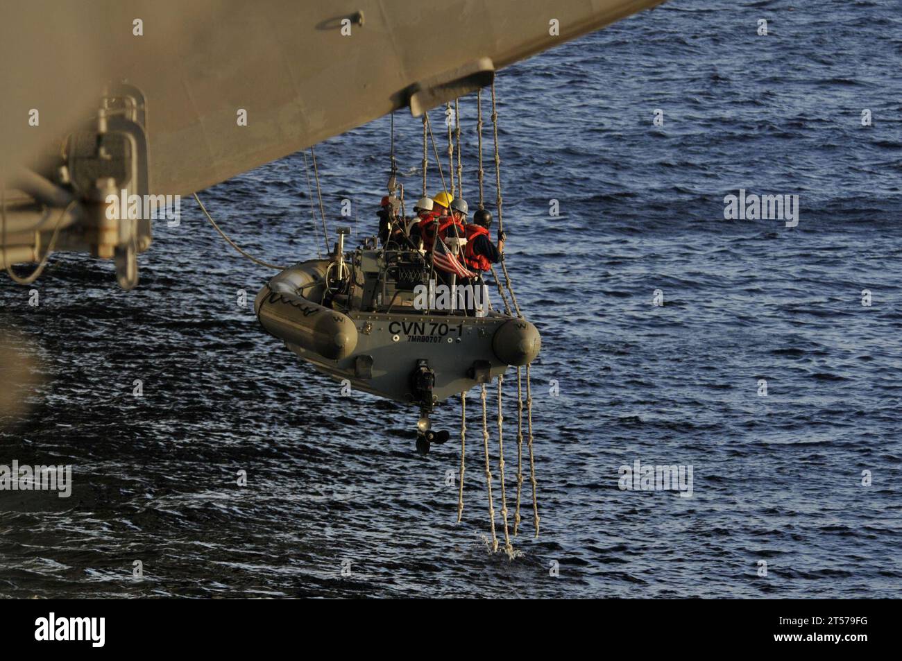 US Navy Sailors launch a rigid hull inflatable boat during a man ...