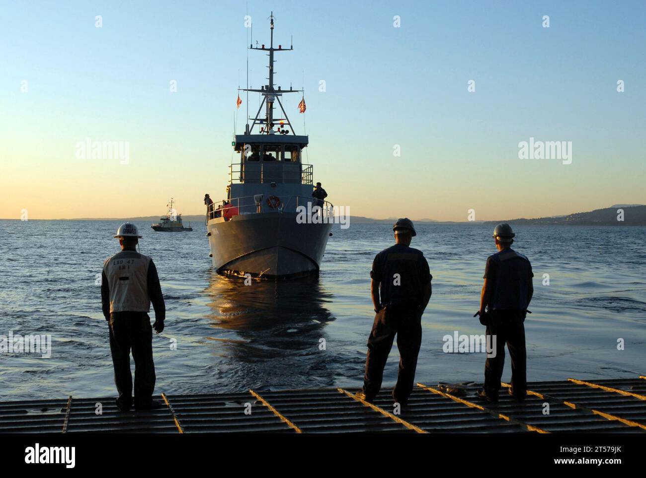US Navy Sailors on the stern gate of the amphibious dock landing ship ...