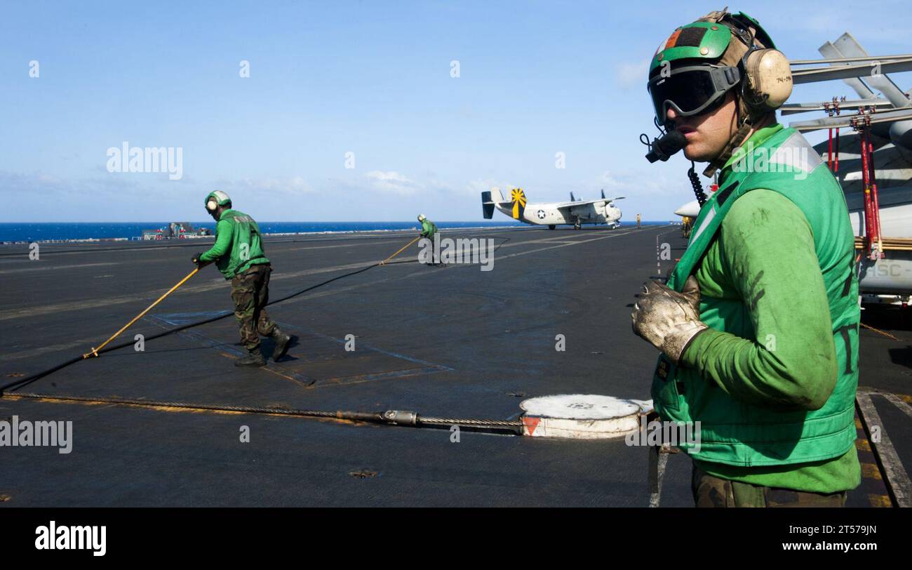 US Navy Sailors observe flight operation on the flight deck.jpg Stock ...