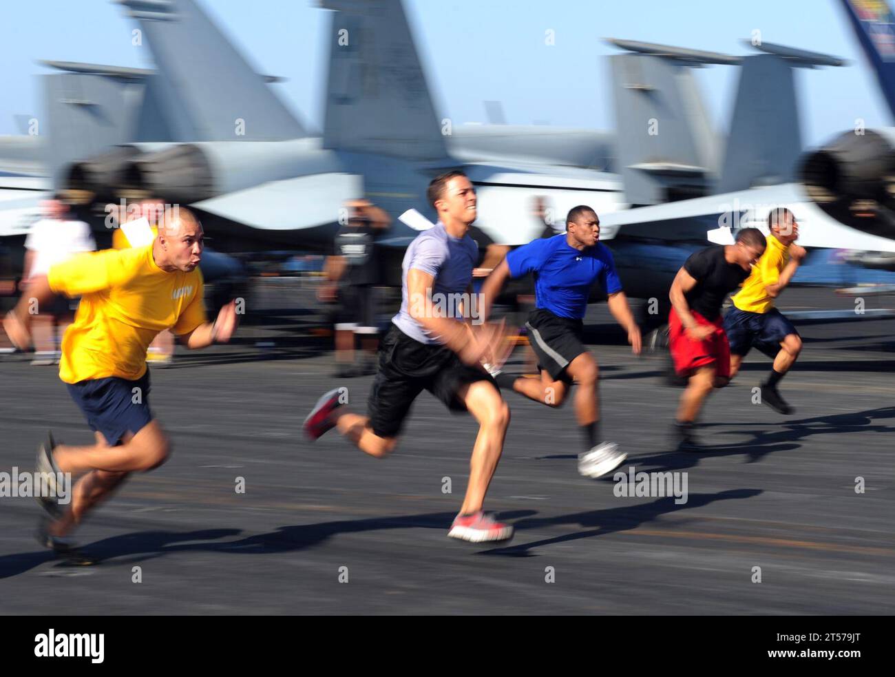 US Navy Sailors participate in a 100-yard dash during a Captain's Cup ...