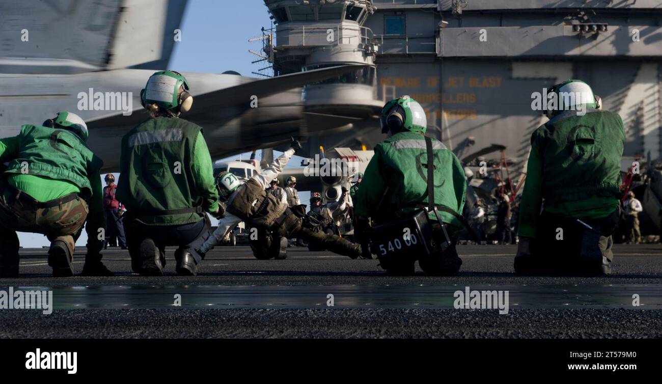 US Navy Sailors observe as a final checker signals safe for launching ...