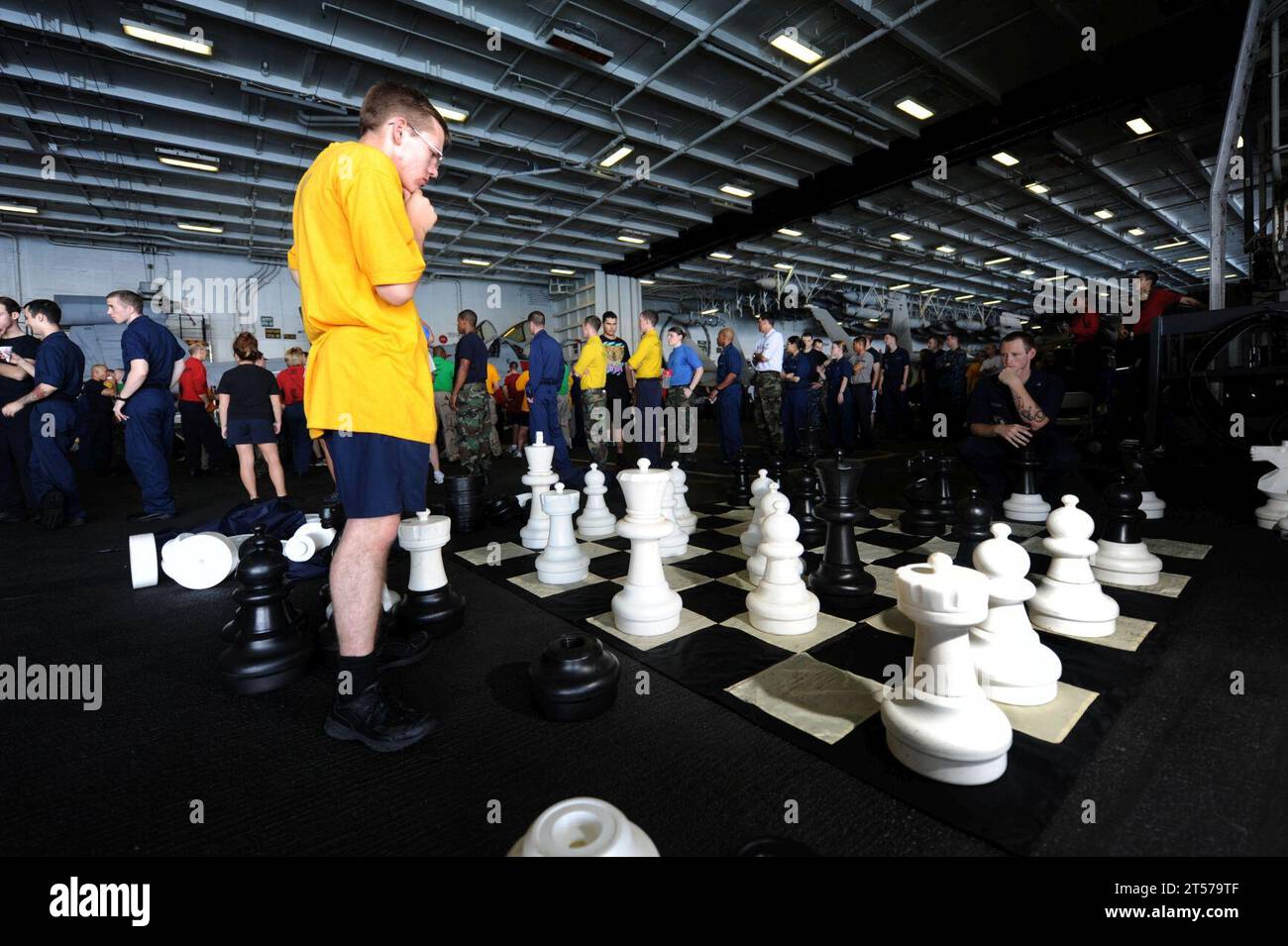US Navy Sailors play a large-scale chess game in hangar bay two during ...