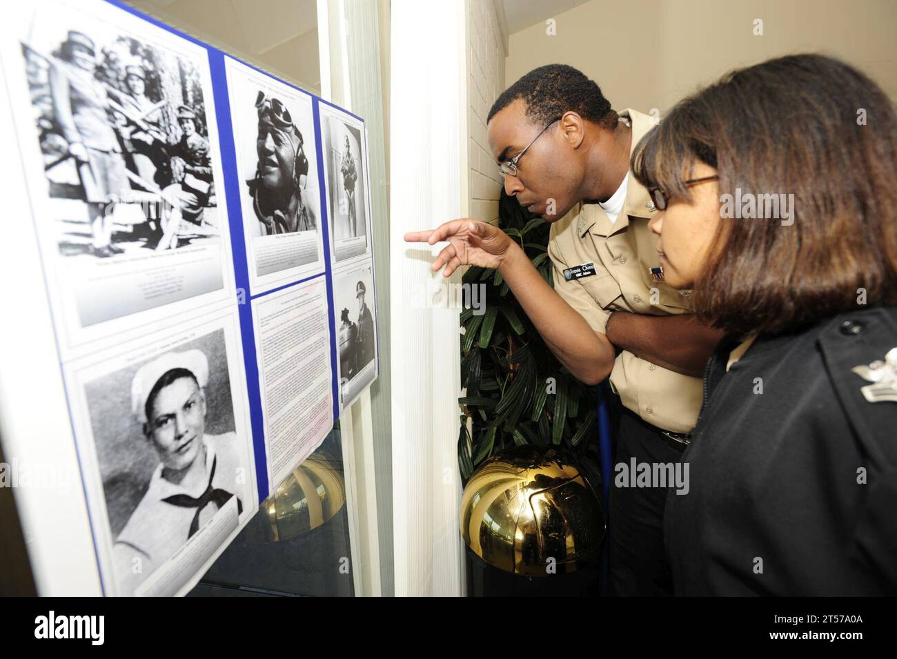 US Navy Sailors read a display on Native American History.jpg Stock ...