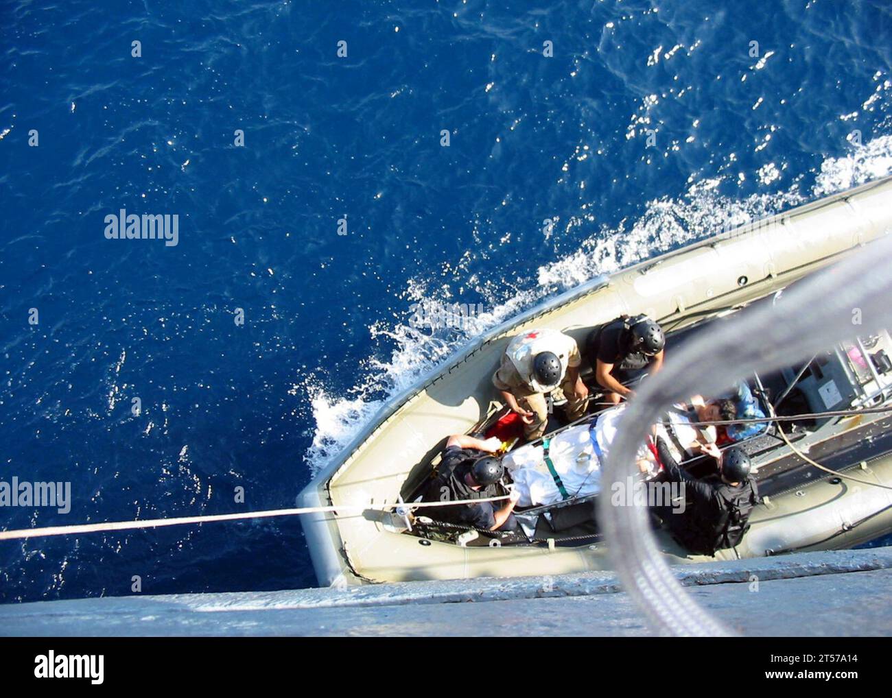 US Navy Sailors prepare to raise an injured crew member of North Korean ...