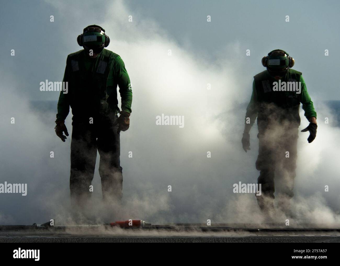 US Navy Sailors reset a steam-powered catapult for flight operations ...