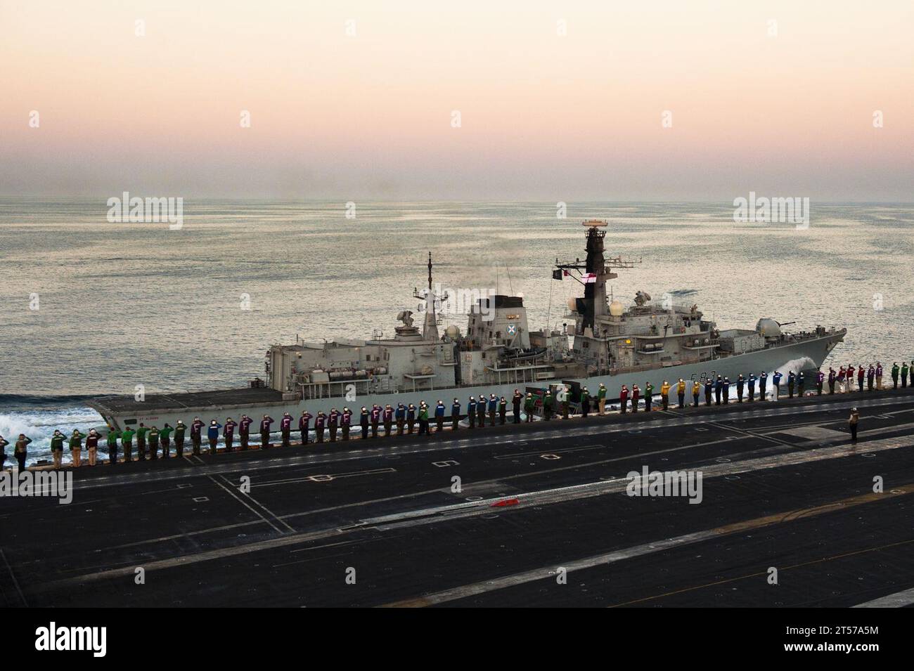 US Navy Sailors render honors as the Royal Navy Duke-class frigate HMS ...