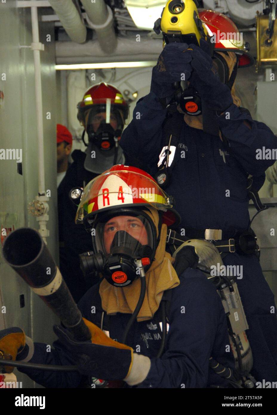 US Navy Sailors simulate firefighting techniques during a general ...