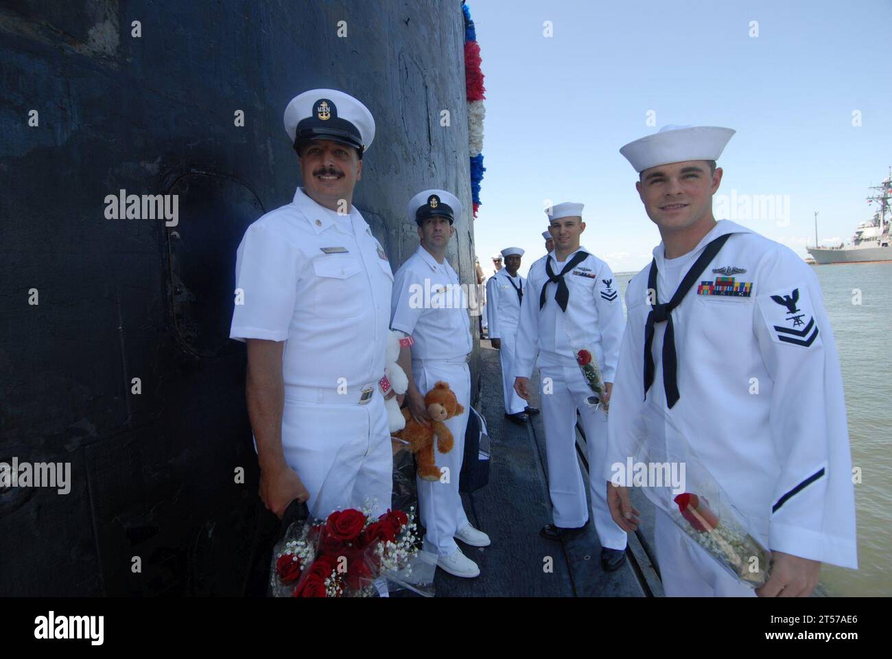 US Navy Sailors wait behind the sail for liberty call to be announced ...