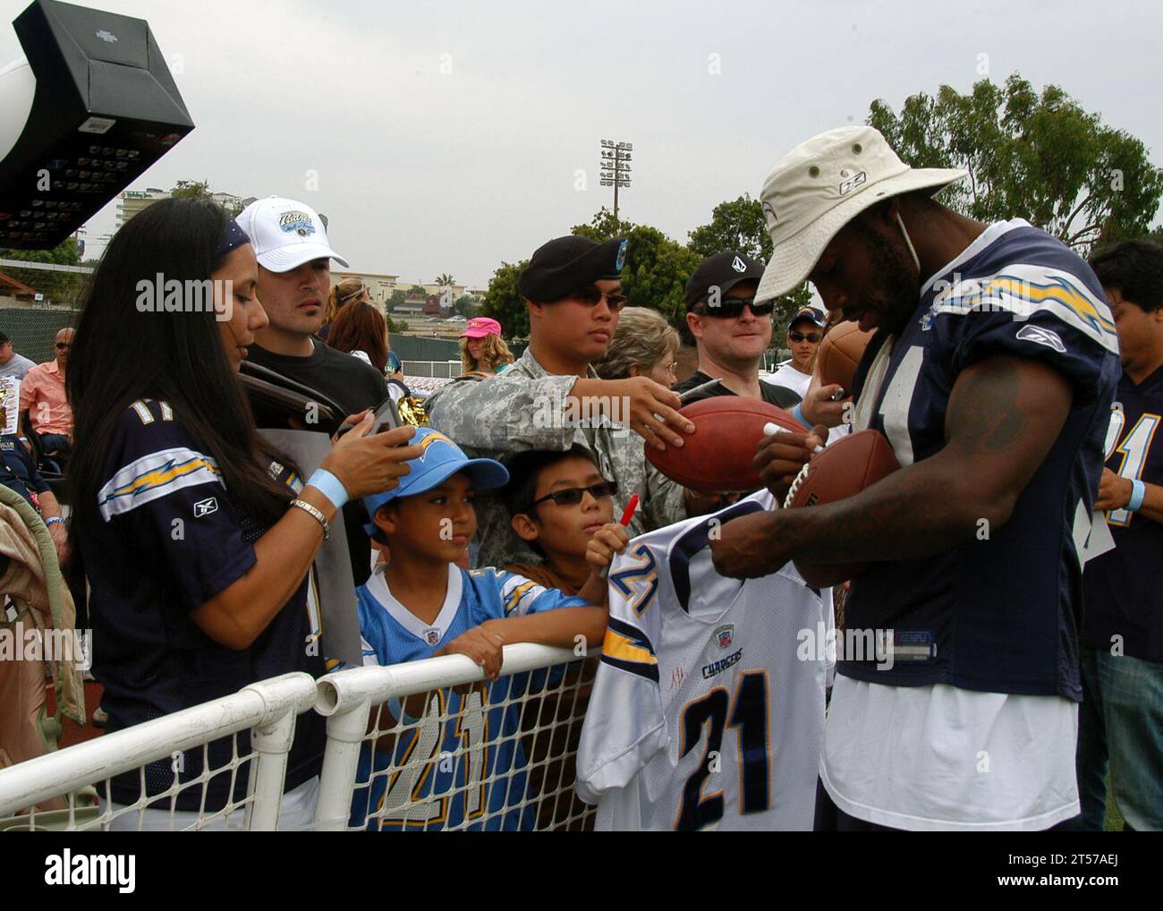 US Navy San Diego Charger Tim Dobbins signs autographs for service ...