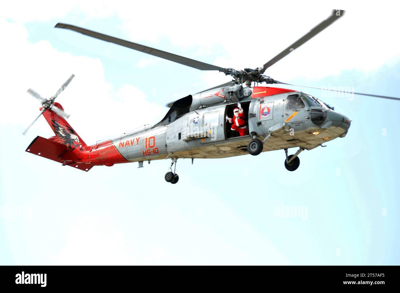 US Navy Santa Clause flies in on an SH-60F Sea Hawk helicopter assigned ...