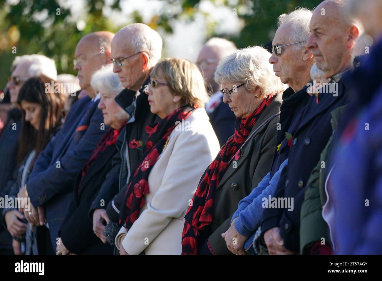 People observe a two minute silence during the official opening of the ...