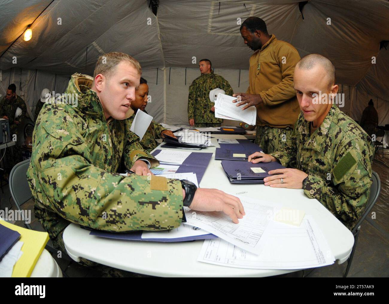 US Navy Seabees chalk packages for an embarkation training exercise.jpg ...