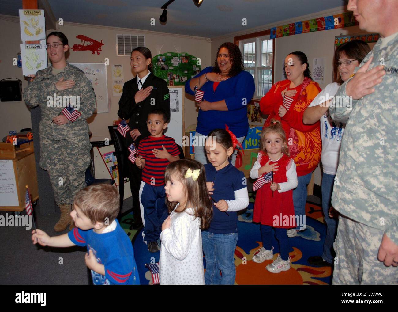 US Navy Service members recite the Pledge of Allegiance with ...